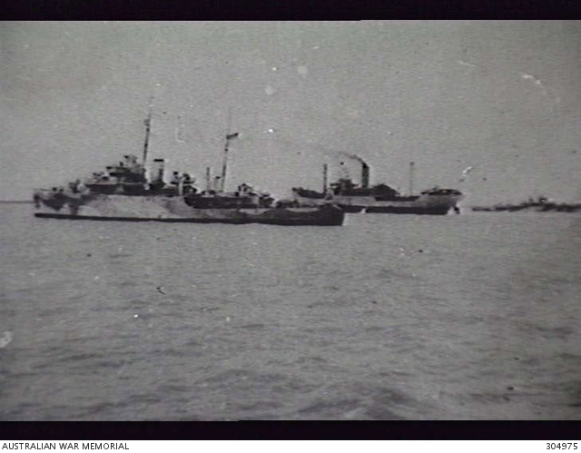 DARWIN, NT. 1942-02. THE SLOOPS HMAS SWAN (LEFT) AND HMAS WARREGO FLANK ...
