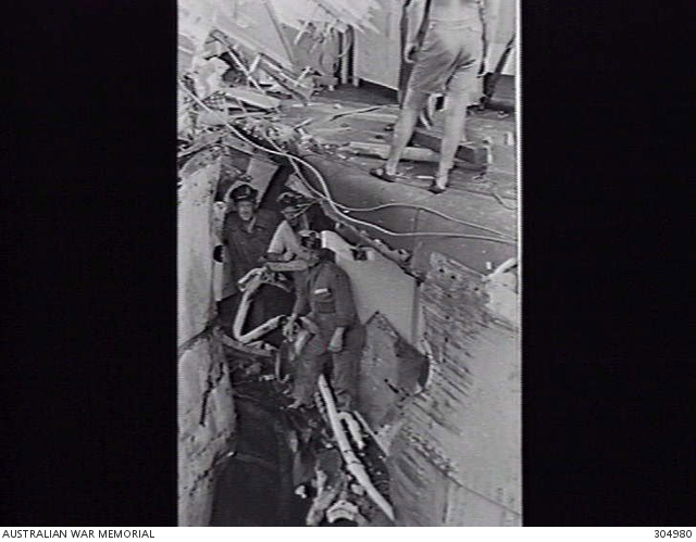 DARWIN, NT. C.1942-02. DAMAGE TO THE CORVETTE HMAS KATOOMBA CAUSED BY A ...