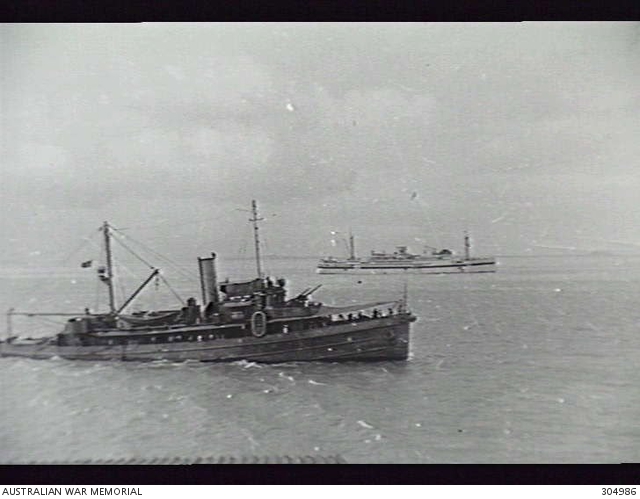 DARWIN, NT. C. 1942. THE US NAVAL SEAPLANE TENDER USS HERON WITH THE ...