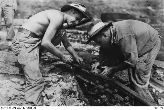 BALIKPAPAN, BORNEO. 1945-07-01. SAPPER D. MACKRILL AIF AND SAPPER R. E ...