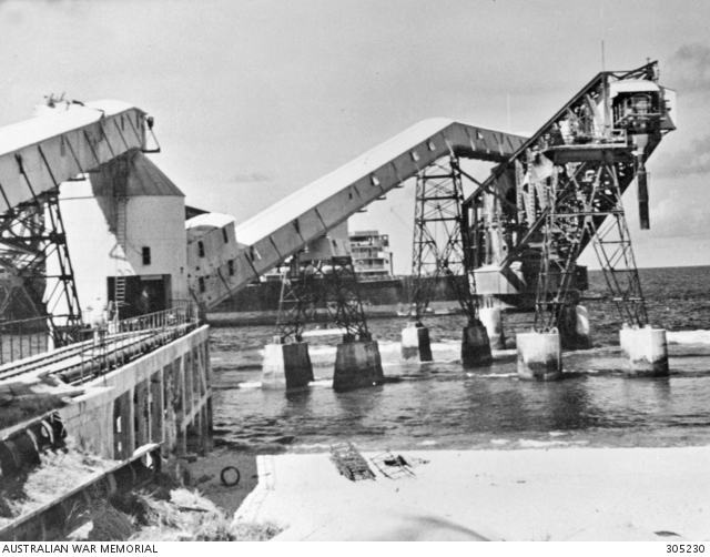 NAURU, PACIFIC OCEAN. 1941. PHOSPHATE CANTILEVER LOADING EQUIPMENT DAMAGED BY SHELLFIRE FROM THE ...