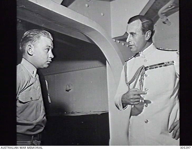 LIEUTENANT D. K. KLAHN USNR, TELLS ADMIRAL THE LORD LOUIS MOUNTBATTEN ...