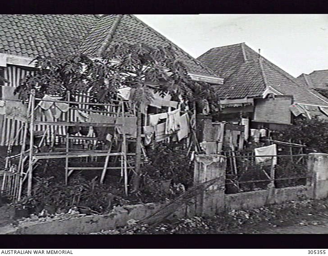 TJIDENG INTERNMENT CAMP, BATAVIA, JAVA. 1945. EXTERIOR OF SOME OF THE ...
