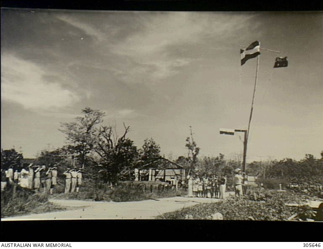 NAMLEA, BOEROE, NETHERLANDS EAST INDIES. 1945-10. OFFICERS SALUTING AT ...