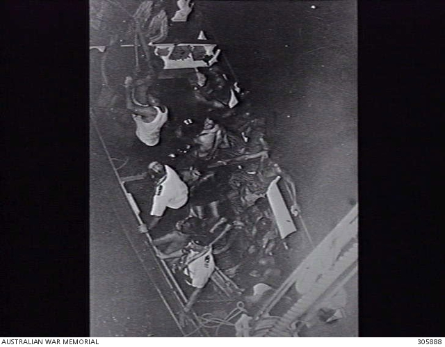 JERVIS BAY, ACT. 1964-02-10. A WHALER WITH PYJAMA CLAD SURVIVORS BEING ...