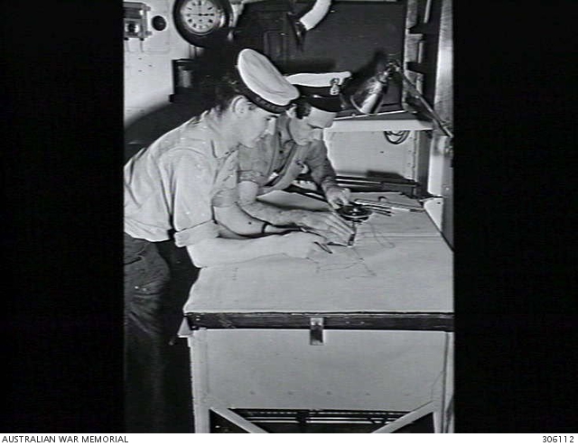 C.1950. RAN PERSONNEL CARRYING OUT A PLOTTING EXERCISE IN THE FRIGATE ...