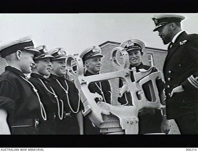 HMAS CERBERUS, FLINDERS NAVAL DEPOT, VIC. 1950. AN OFFICER SPEAKING TO ...