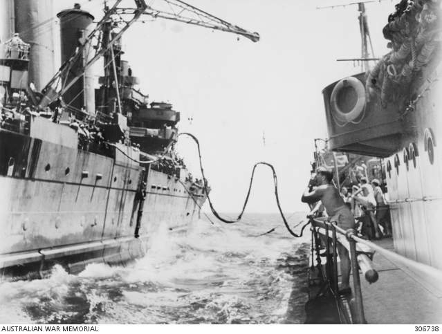 The destroyer HMAS Warramunga being refuelled from the cruiser HMAS ...