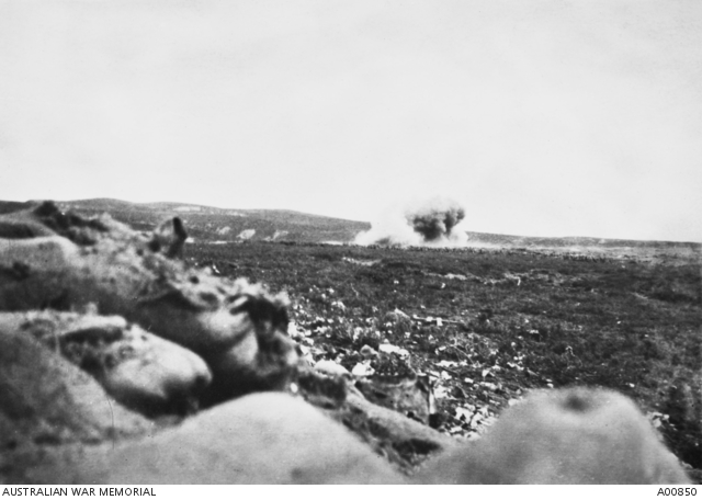 A 6" Howitzer shell bursting in the Turkish trenches. The photograph ...