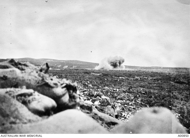 A 6" Howitzer shell bursting in the Turkish trenches. The photograph ...