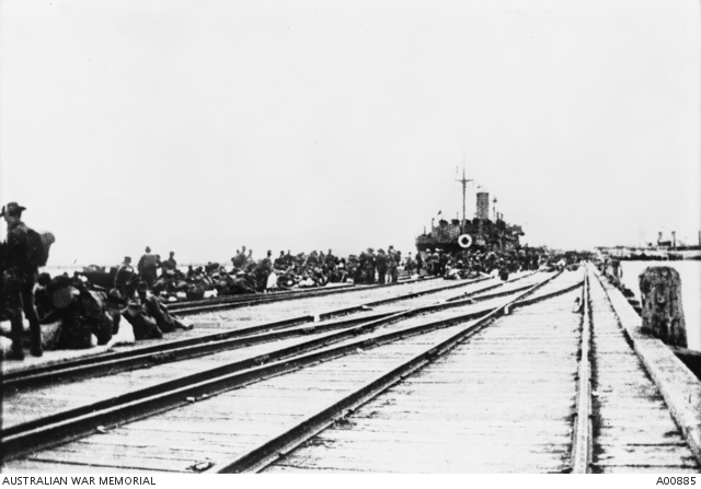 Men waiting on the wharf prior to embarking SS Ballarat, which is ...