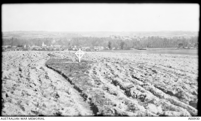 Two crosses, the large white cross marking the grave of an Australian ...