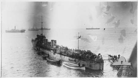 The 14th Battalion going ashore in a destroyer from HMAT Seang Choon ...