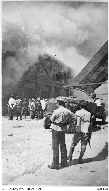 Smoke billowing from a building during street fires after the ...