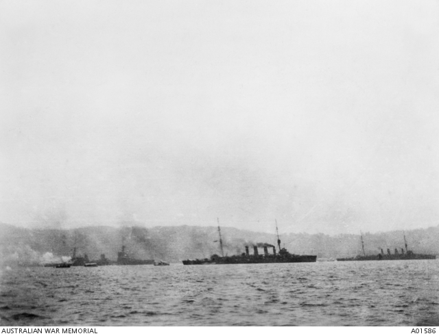HMAS Australia (left) firing a salute on the occasion of the hoisting ...