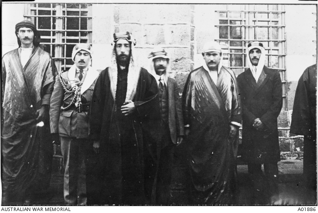 An informal group portrait of the Sheriff of Mecca and his staff ...