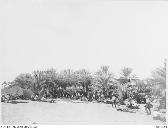 Australian and British troops resting under the palm hods prior to the ...