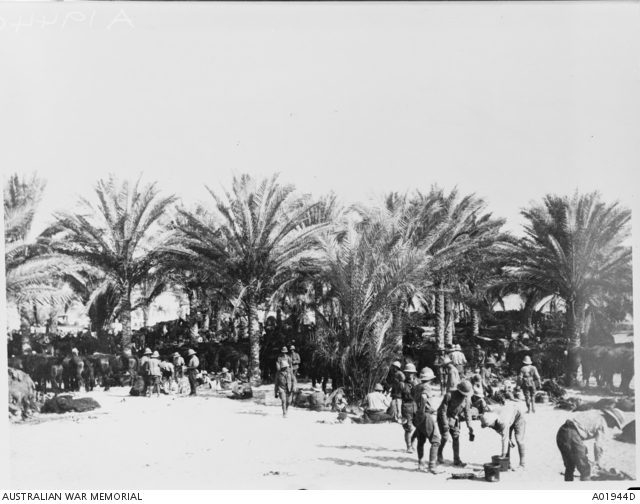 Australian and British troops resting under the palm hods prior to the ...