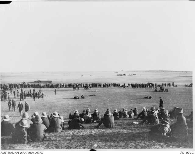 Spectators at a race meeting at Rafa. This is the right hand image in a ...