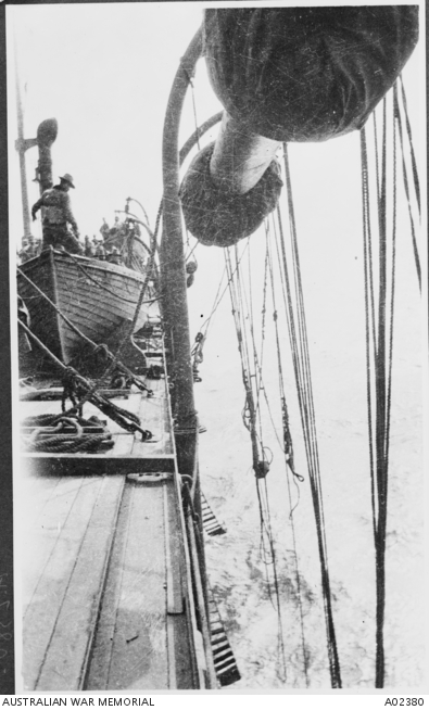 Boats laden with troops ready to be lowered into the sea from the ...