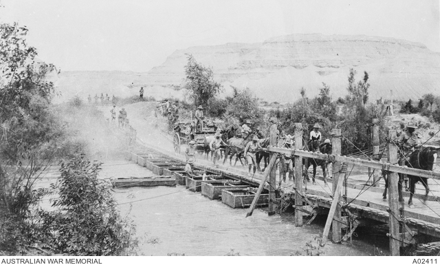 The first pontoon bridge being built over the Jordan River, nearing ...