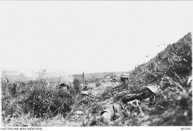 A platoon of the New Zealand Rifle Brigade in support, in their shell ...