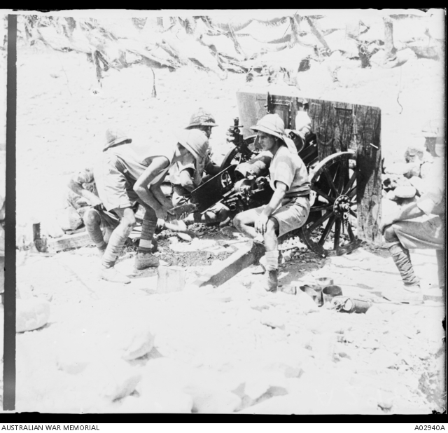 Members of the 11th Mountain Battery in action using a light field 3.7 ...