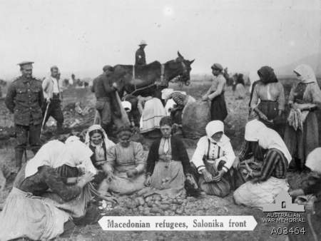 A group of Macedonian refugees. A soldier stands in the left background ...