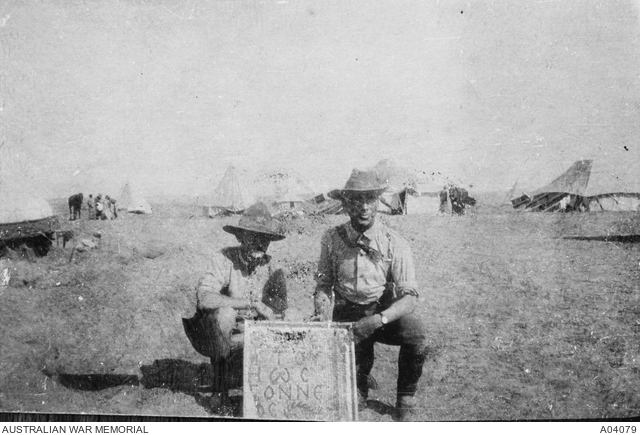 Two unidentified men holding a section of the Shellal Mosaic prior to ...