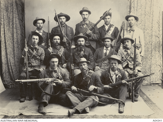 Group portrait of Boers with their Commandant. Most of the men are ...