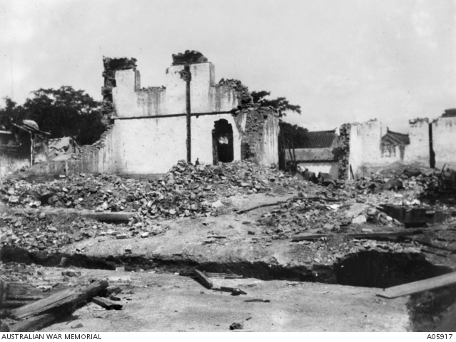 PEKING, CHINA. 1900. A BUILDING IN LEGATION STREET DESTROYED DURING THE ...