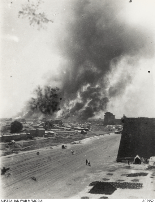 PEKING, CHINA. 1900. FLAMES RISE HIGH IN THE AIR AS A FIRE IN THE ...