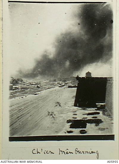 PEKING, CHINA. 1900. A FIRE IN THE TOP SECTION OF THE CHIEN MEN GATE ...