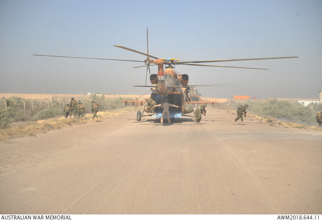 Iraq Army Rangers disembark from a MI-17 during a training activity ...