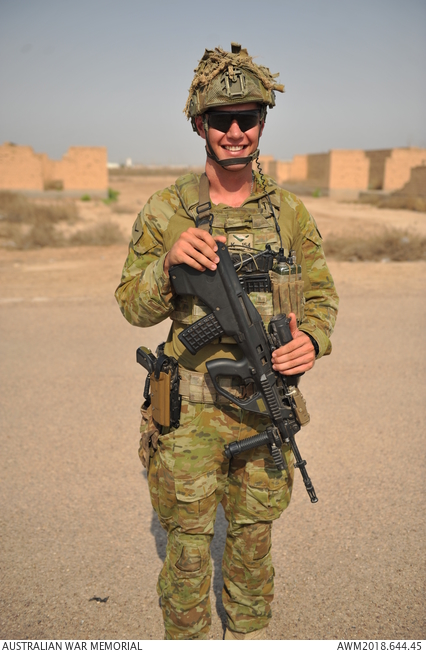 LCPL Brett Cranston (3 RAR) smiles as his ‘picture for mum’ is taken at ...