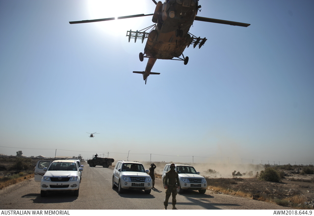 An Iraqi MI-17 helicopter flies low over Australian trainers from Task ...