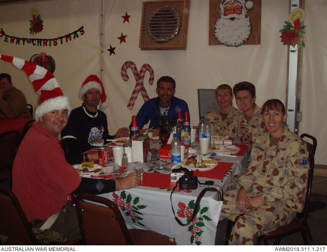 Christmas lunch at the DFAC. Identified left to right: Major Jason ...