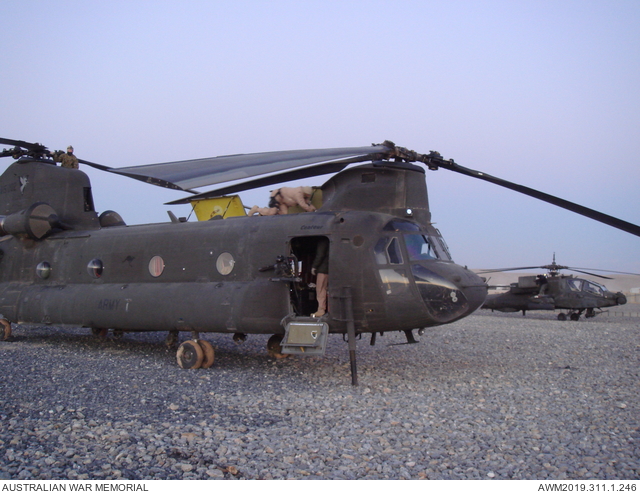 The crew of Australian Army Chinook A15-202 prepare the aircraft for ...