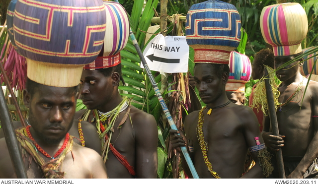 Boys wearing the Upe hat of initiation arrive in a village to vote in ...