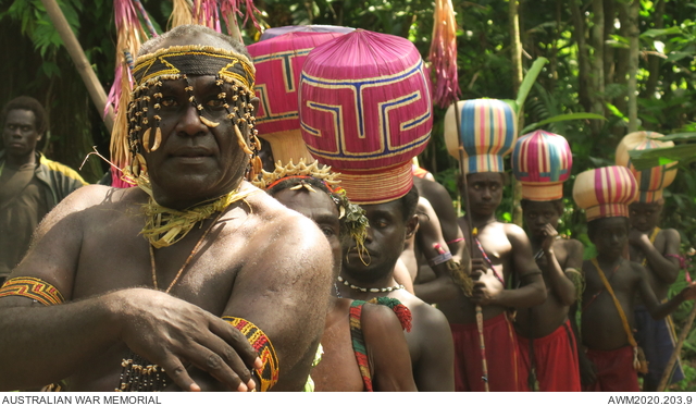 Boys wearing the Upe hat of initiation arrive in a village to vote in ...