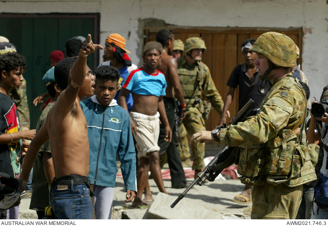 ADF troops patrol the streets of Dili during Operation Astute to ...