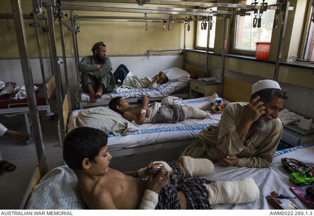 From foreground: Abdul Rashid (8), Hamisha Gul (65, the boys' father ...