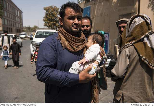Agence France Presse Photographer Noorullah Shirzada carries his infant ...