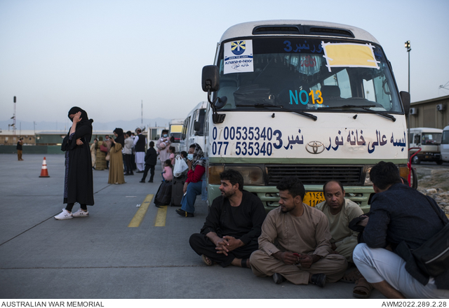 The drivers of a convoy of mini-buses used to transport Afghan evacuees ...