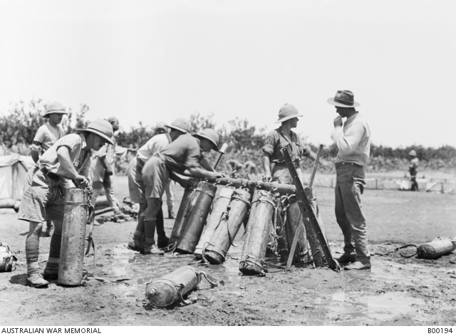 Members of the Imperial Camel Corps filling water containers ...
