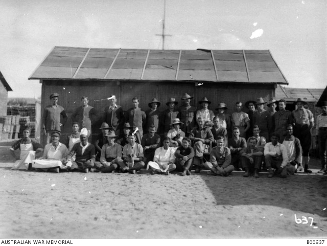 A group including Mrs. Chisholm and her staff at the canteen. No ...