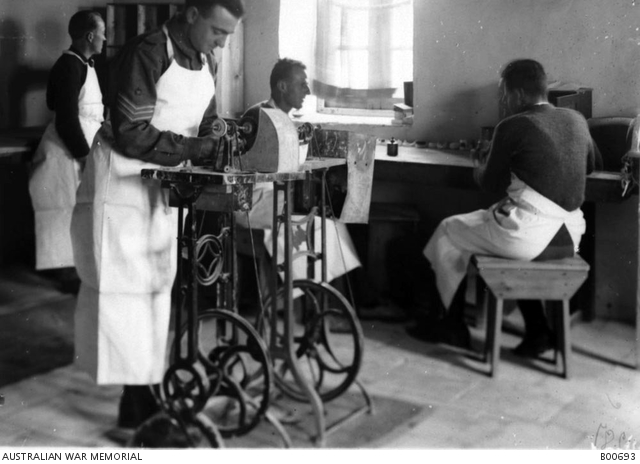 Four technicians in the mechanical room of the Australian Dental ...