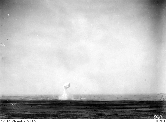 Close up view of exploding captured ammunition. | Australian War Memorial