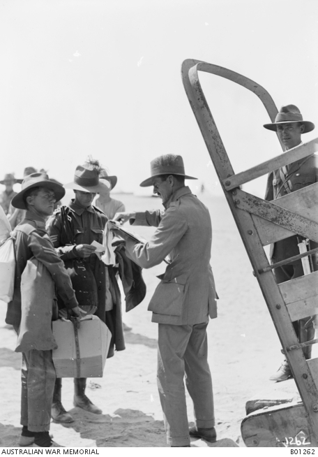 Checking the names of a Corporal and a Sergeant on the rolls of the 3rd ...