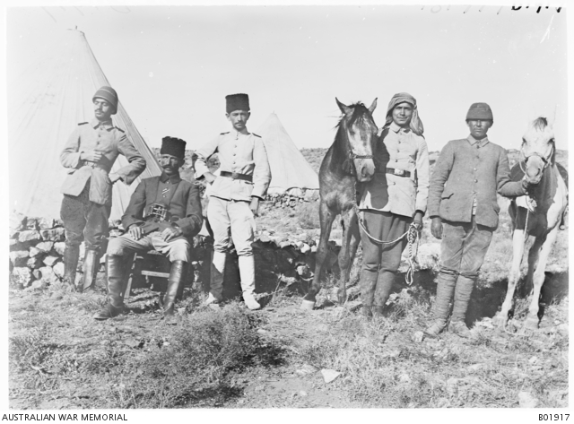 Three Turkish officers and two servants with their ponies, in an enemy ...